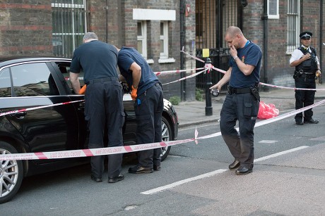 Police Officers Examine Car Crime Scene Editorial Stock Photo - Stock ...