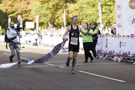 Winner Crosses Finish Line Editorial Stock Photo - Stock Image ...