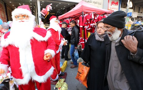 Iraqis Walk Past Inflatable Santa Claus Editorial Stock Photo - Stock ...