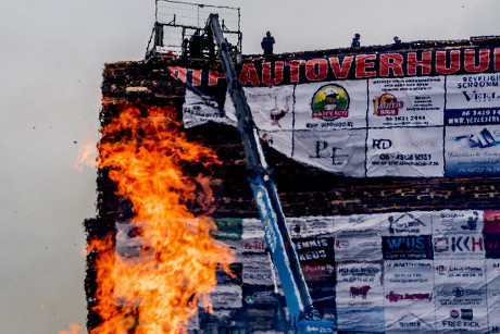 Preparations for the annual new years bonfire at the beach of ...
