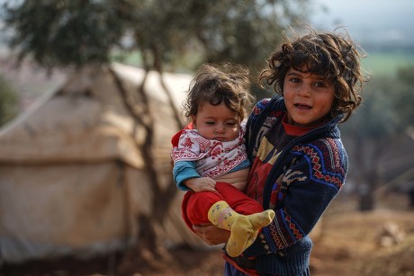 Displaced Child Carries Younger One Inside Editorial Stock Photo ...