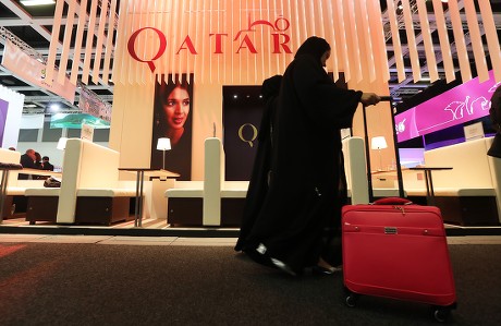 Woman Suitcase Walks Past Qatar Stand Editorial Stock Photo - Stock ...