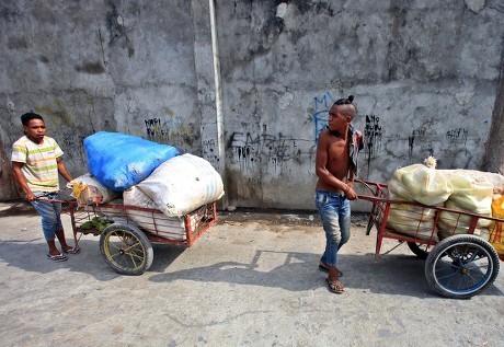 East Timorese Workers Push Their Carts Editorial Stock Photo - Stock ...