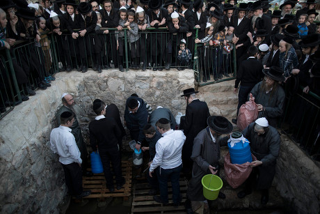 Ultra-Orthodox Jews collect water from mountain spring outside ...