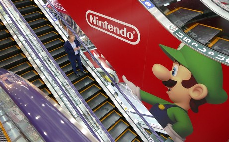 Customer Rides Escalator Past Advertisement Nintendo Editorial Stock ...
