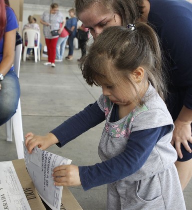 Child Casts Vote His Mother Polling Editorial Stock Photo - Stock Image ...