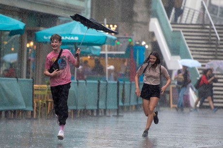People Run Through Rain Shield Themselves Editorial Stock Photo - Stock ...