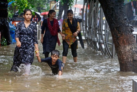 People Wade Through Waterlogged Roads During Editorial Stock Photo ...