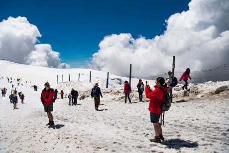 Tourists Pose On Snow Covered Top Editorial Stock Photo - Stock Image ...