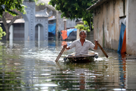 Man Rows Boat Through Flooded Area Editorial Stock Photo - Stock Image ...