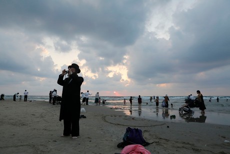 Ultra-Orthodox Jews enjoy the beach of Tel Aviv, Israel - 07 Aug 2018 ...
