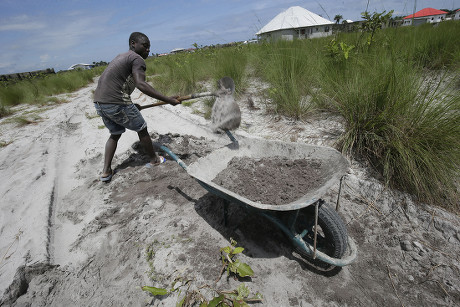 Youths work at construction sites in Monrovia, Marshall City, Liberia ...