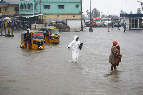 People Walk Through Floodwaters On Street Editorial Stock Photo - Stock ...