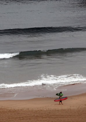 Two Surfers Leave Water After Surfing Editorial Stock Photo - Stock ...