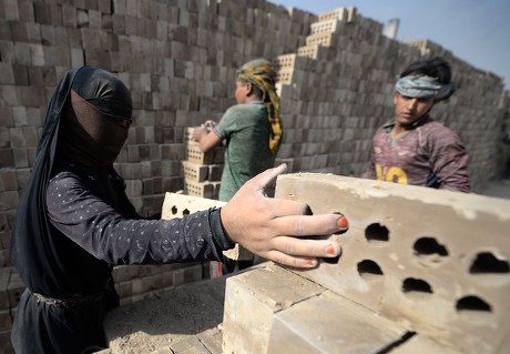 Iraqis work at a brick factory in Baghdad, Iraq - 28 Aug 2018 Stock ...