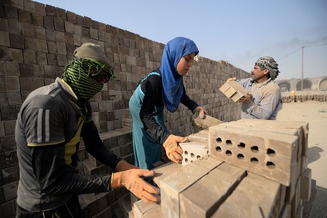 Iraqis work at a brick factory in Baghdad, Iraq - 28 Aug 2018 Stock ...