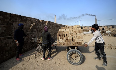 Iraqis work at a brick factory in Baghdad, Iraq - 28 Aug 2018 Stock ...