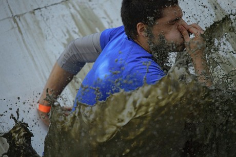 Participant Jumps Into Sludge Basin During Editorial Stock Photo ...
