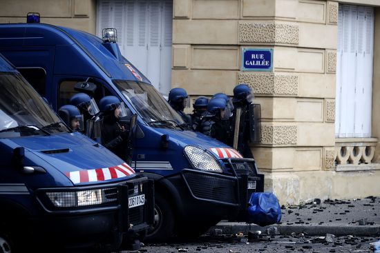 Police Officers Hide Behind Wall During Editorial Stock Photo - Stock ...
