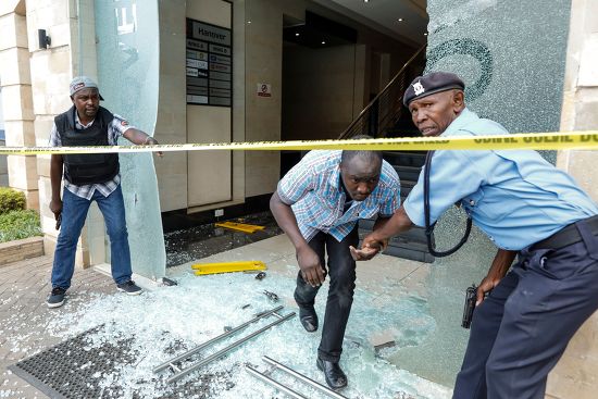 Police Officer Helps Man Evacuate Building Editorial Stock Photo ...
