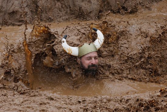 Participant Makes His Way Through Muddy Editorial Stock Photo - Stock ...