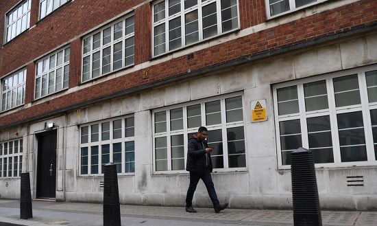 Pedestrian Passes Old Spy Building On Editorial Stock Photo - Stock ...