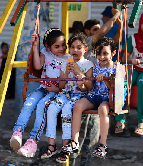 Iraqi Children Play On Swings During Editorial Stock Photo - Stock ...