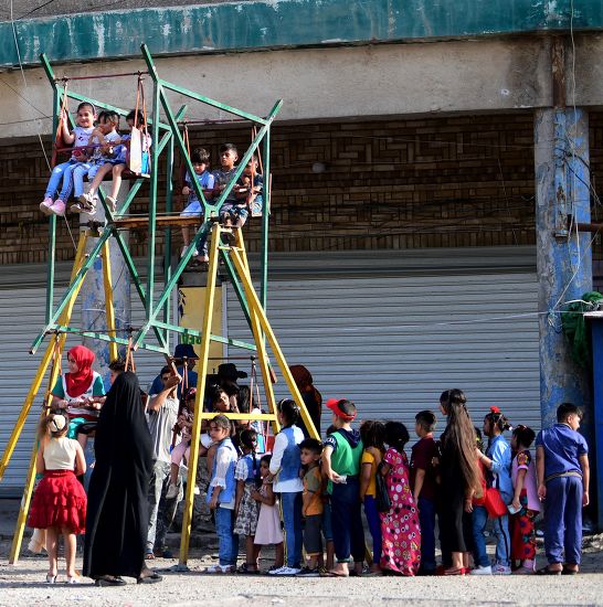 Iraqi Children Play On Swings During Editorial Stock Photo - Stock ...