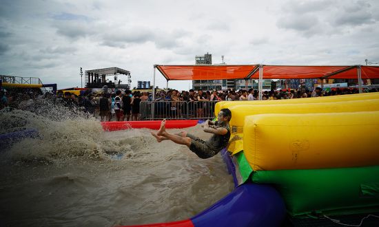 Festivalgoers Jump Into Mud Pool During Editorial Stock Photo - Stock ...