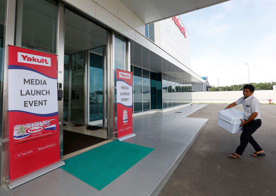 Staff Member Carries Box During Yakult Editorial Stock Photo - Stock ...