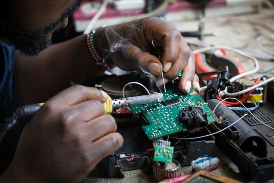 Electronic Repair Man Works On Radio Editorial Stock Photo - Stock ...