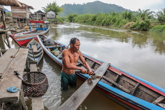 Fisherman Guts Fish On River Bank Editorial Stock Photo - Stock Image ...