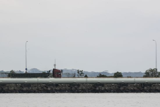Cargo Truck Drives Across Causeway Towards Editorial Stock Photo ...