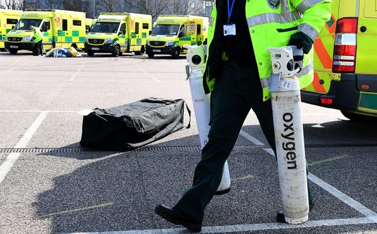 Ambulance Worker Unloads Oxygen Tanks Outside Editorial Stock Photo ...