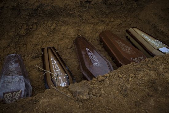Coffins Sit Inside Mass Grave During Editorial Stock Photo - Stock ...