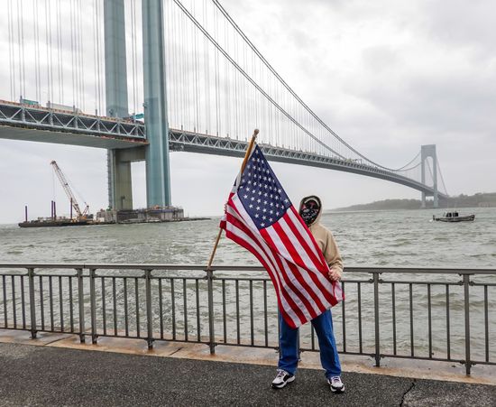 Flagbearing Spectator Salutes On Brooklyn Shoreline Editorial Stock ...