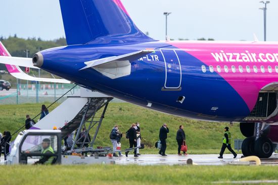 Passengers Leaving Plane After Arriving On Editorial Stock Photo ...