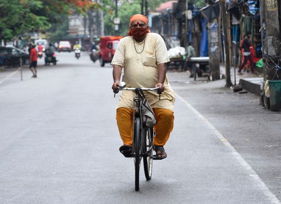 Hindu Priest On Bicycle During Ongoing Editorial Stock Photo - Stock ...