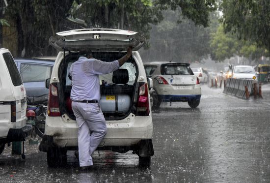 Man Takes Shelter Rain Under Trunk Editorial Stock Photo - Stock Image ...