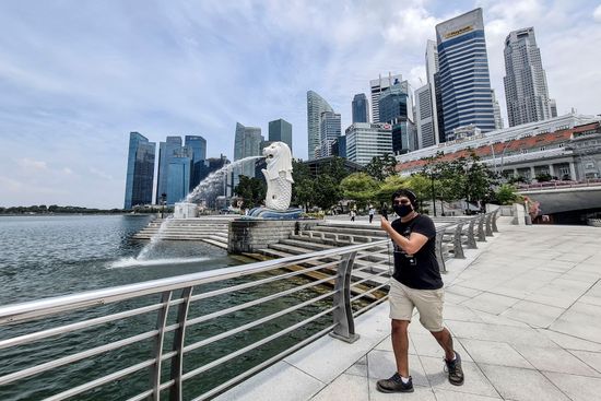 Woman Walks Past Merlion Statue Financial Editorial Stock Photo - Stock ...