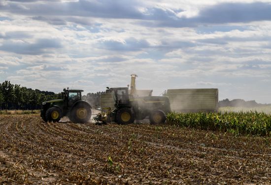 Harvester Accompanied By Tractor Silo Trailer Editorial Stock Photo ...