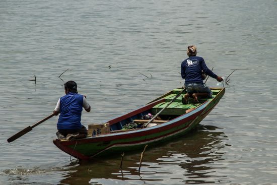 Boatman Rows His Boat On Cimanuk Editorial Stock Photo - Stock Image ...