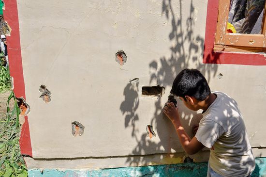 Boy Inspects Bullet Ridden Wall Damaged Editorial Stock Photo - Stock ...