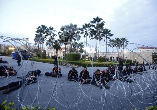 Police Officers Rest Behind Barbed Wire Editorial Stock Photo - Stock ...