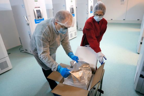 Romanian Health Workers Manipulate Boxes Containing Editorial Stock ...