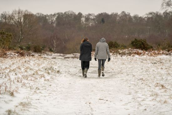 Two Women Walk Through Snow Ashdown Editorial Stock Photo - Stock Image ...