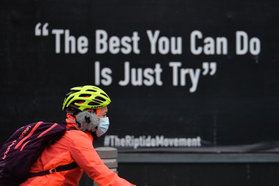 Cyclist Wearing Face Mask Passes By Editorial Stock Photo - Stock Image ...