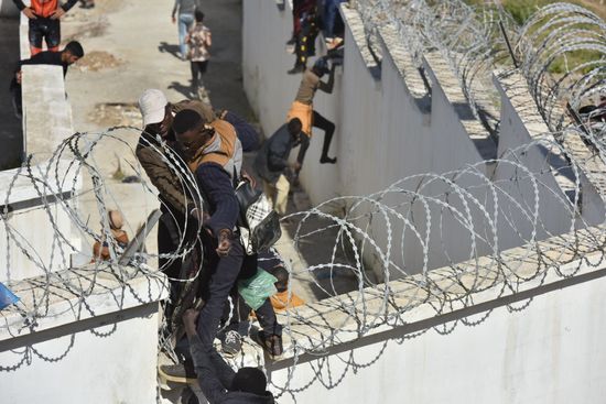 Immigrants Climb Over Border Fence Enter Editorial Stock Photo - Stock ...