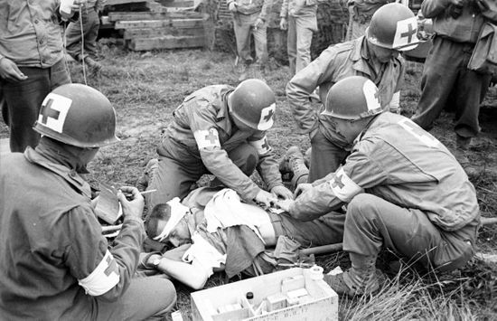 Medics Giving First Aid Treatment Wounded Editorial Stock Photo - Stock ...
