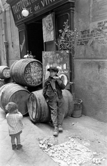 Child Leaning Against Barrel During First Editorial Stock Photo - Stock ...